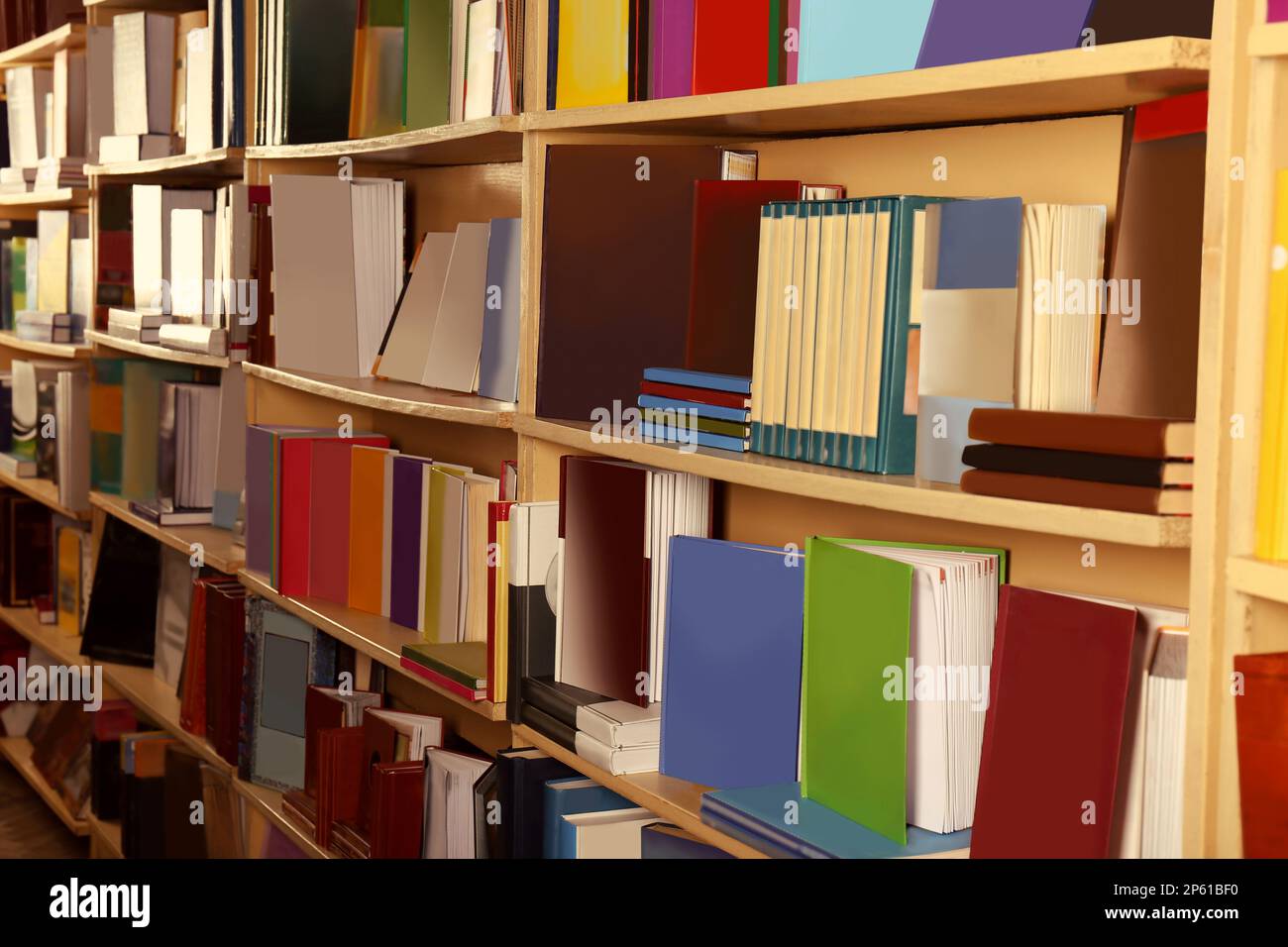 Collection of different books on shelves in library Stock Photo - Alamy