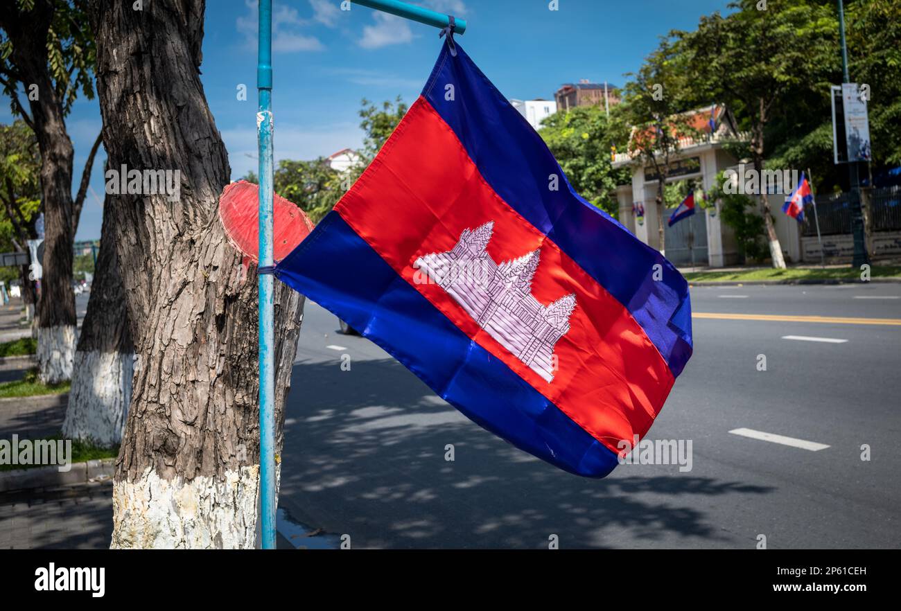 A Cambodian flag flies next to a road in central Phnom Penh in Cambodia ...