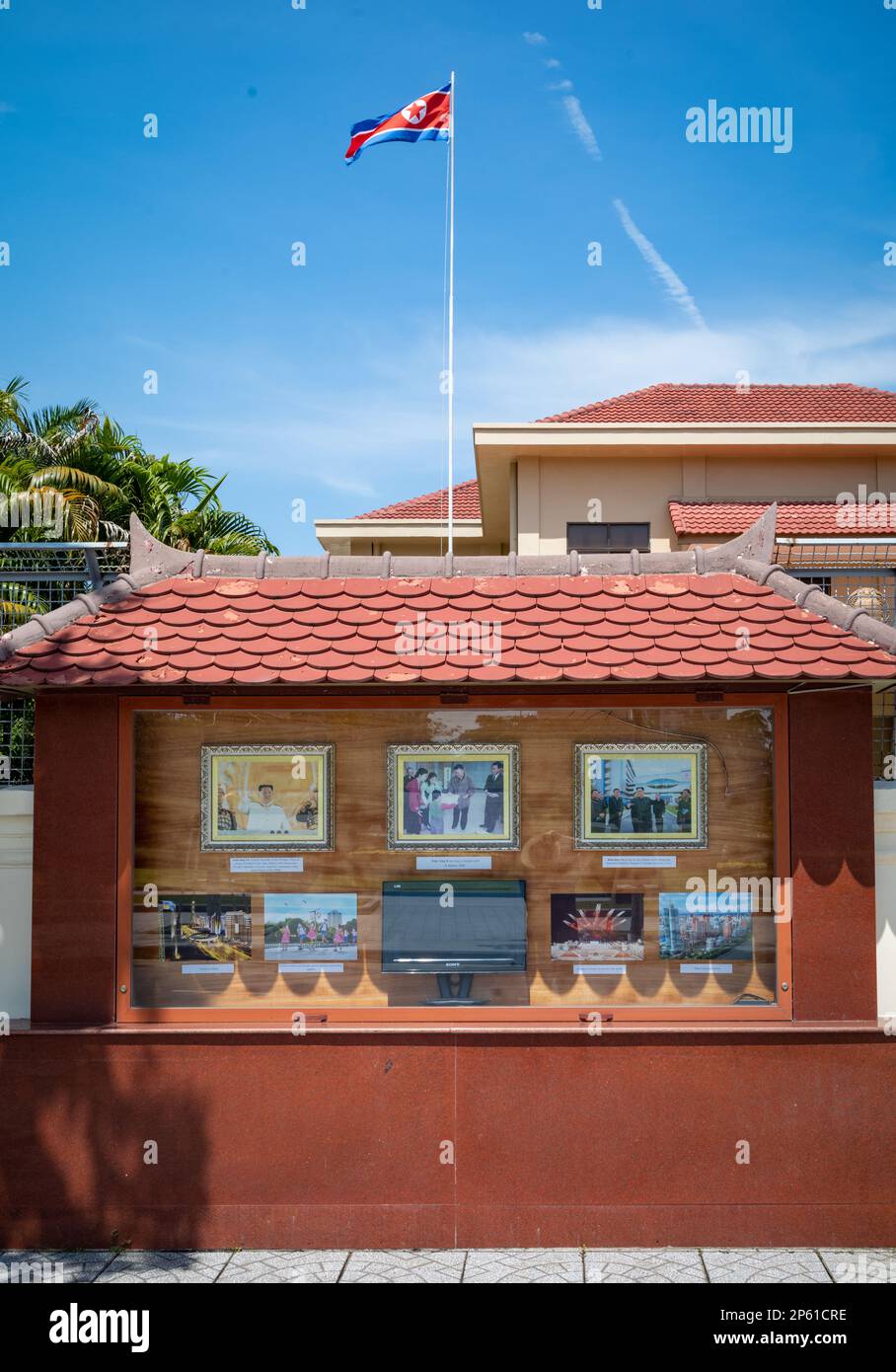 Propaganda photographs on display outside the Democratic Republic of ...