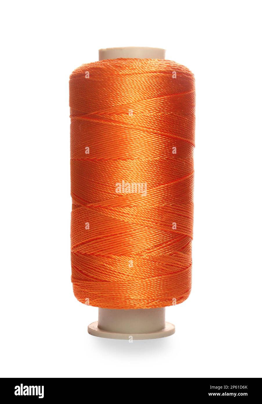 Spool of orange sewing thread isolated on white Stock Photo - Alamy