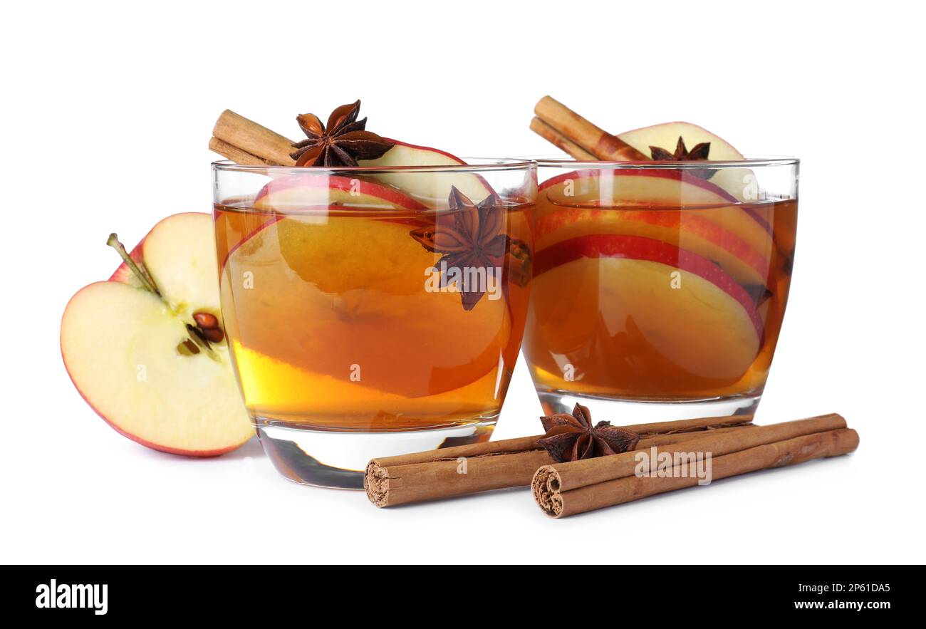 Hot mulled cider and ingredients on white background Stock Photo - Alamy
