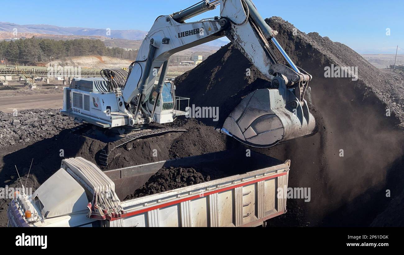 Excavator Working On Huge Mining Site, Loading The Trucks, Trucks ...