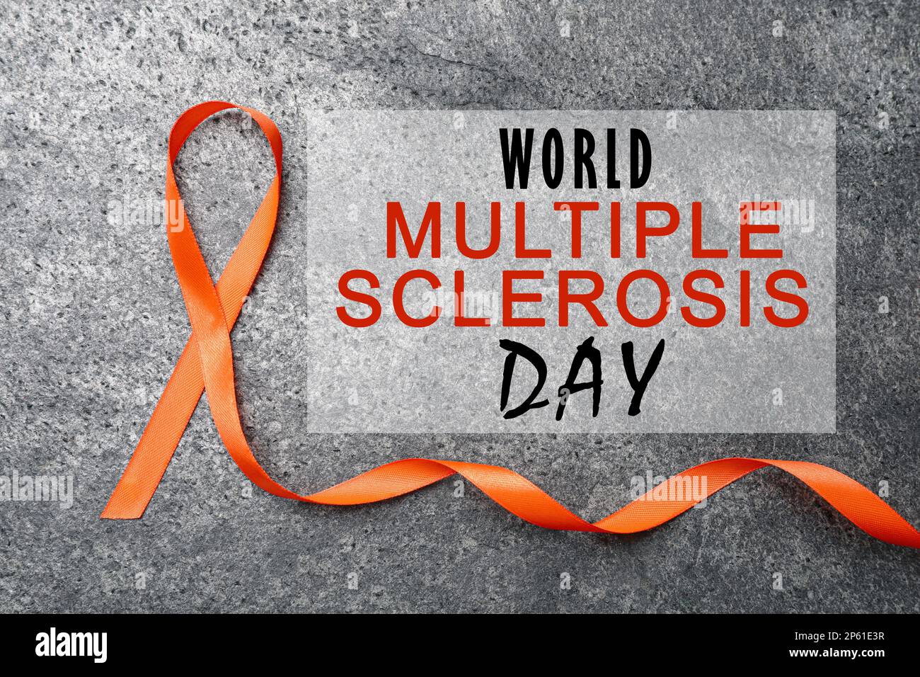 Multiple Sclerosis Awareness Day. Orange ribbon on grey background, top ...
