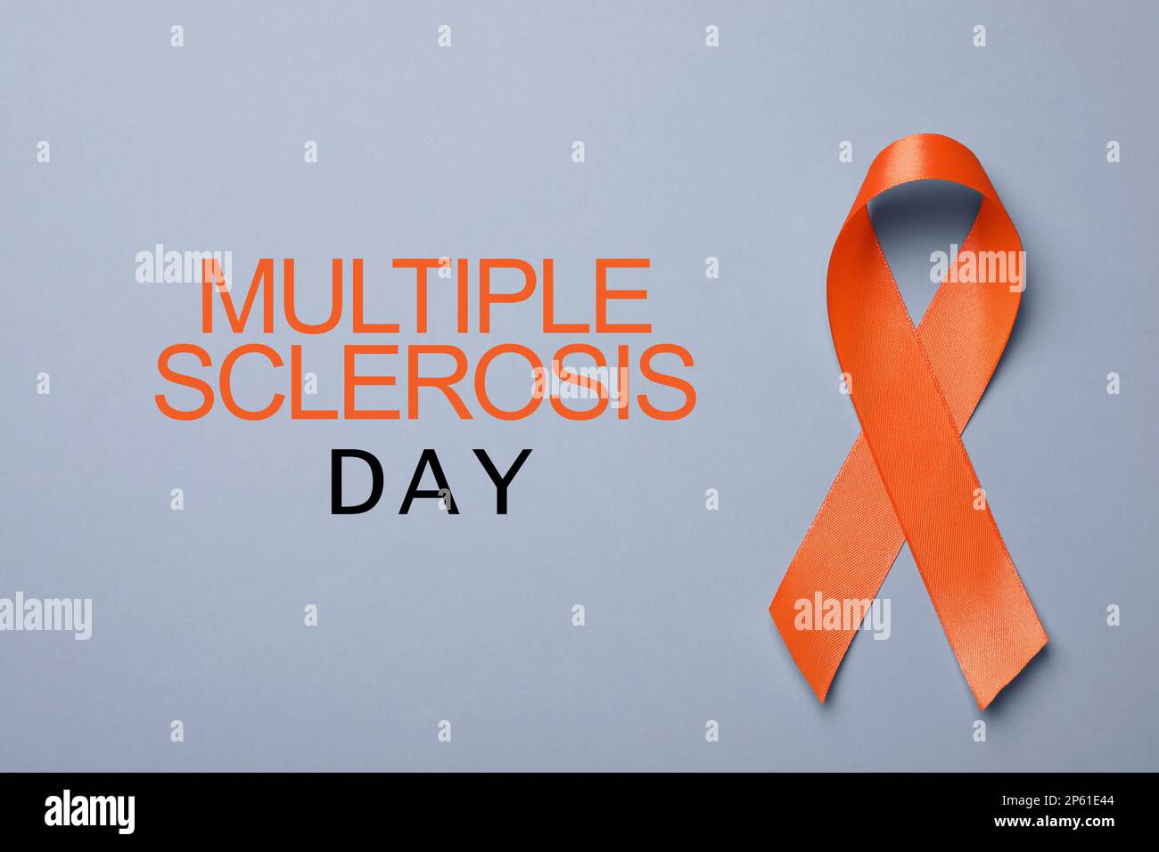 Multiple Sclerosis Awareness Day. Orange ribbon on grey background, top ...