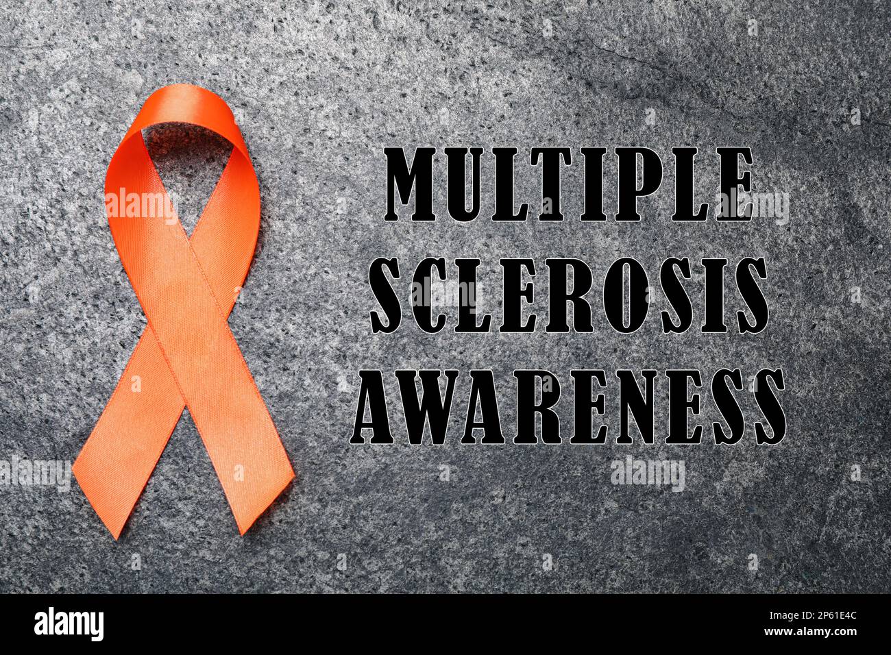 Multiple Sclerosis Awareness Day. Orange ribbon on grey background, top ...