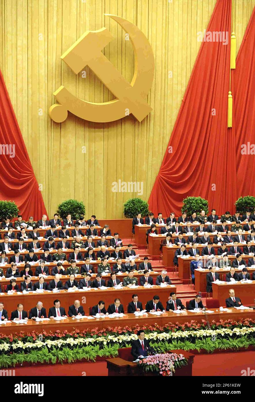 China's President Hu Jintao (below) delivers his speech during the 18th ...