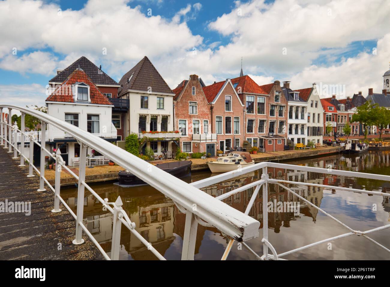 Ancient canal houses and bridge in the city center of Dokkum in ...
