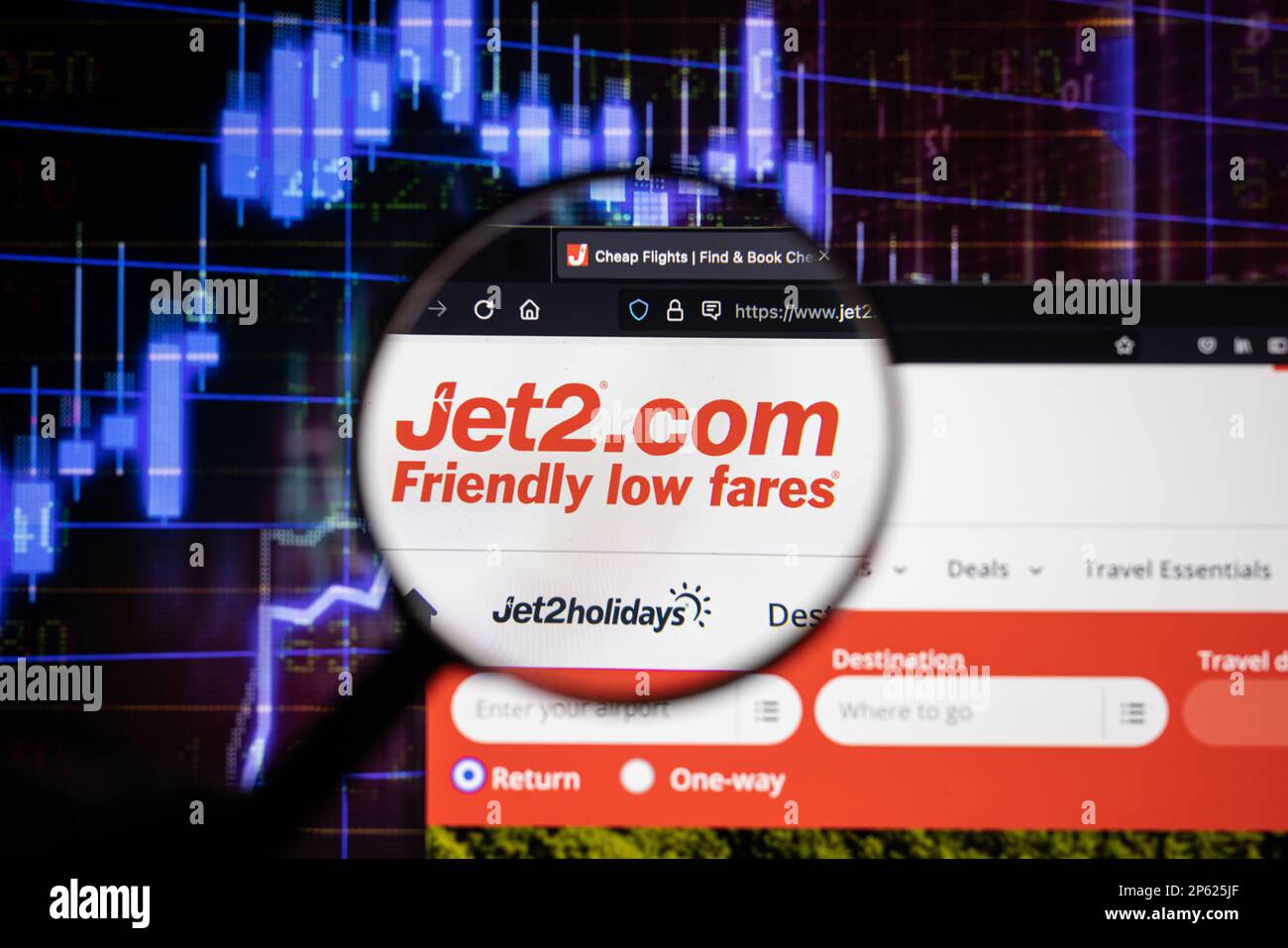 Jet2 airline company logo on a website with blurry stock market ...
