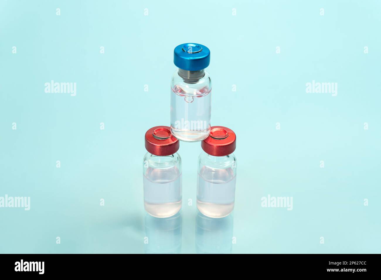 Medical Glass vials for transparent liquid samples on blue background ...