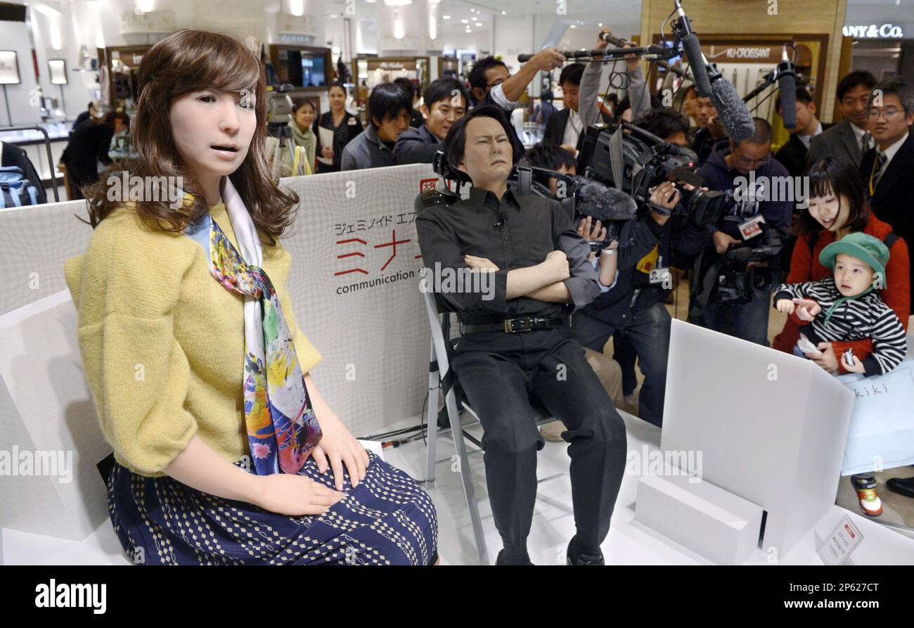 CLARIFIES THE SECOND SENTENCE - A humanoid robot named Minami, left ...