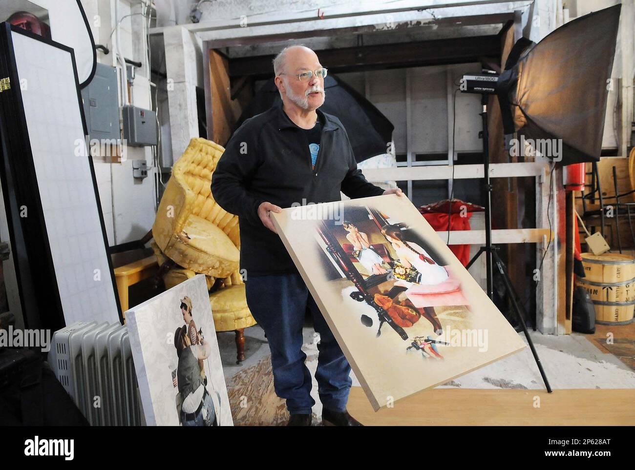 In this Oct. 19, 2012 photo, Alaska Photographer Jeff Fitzwater shows ...