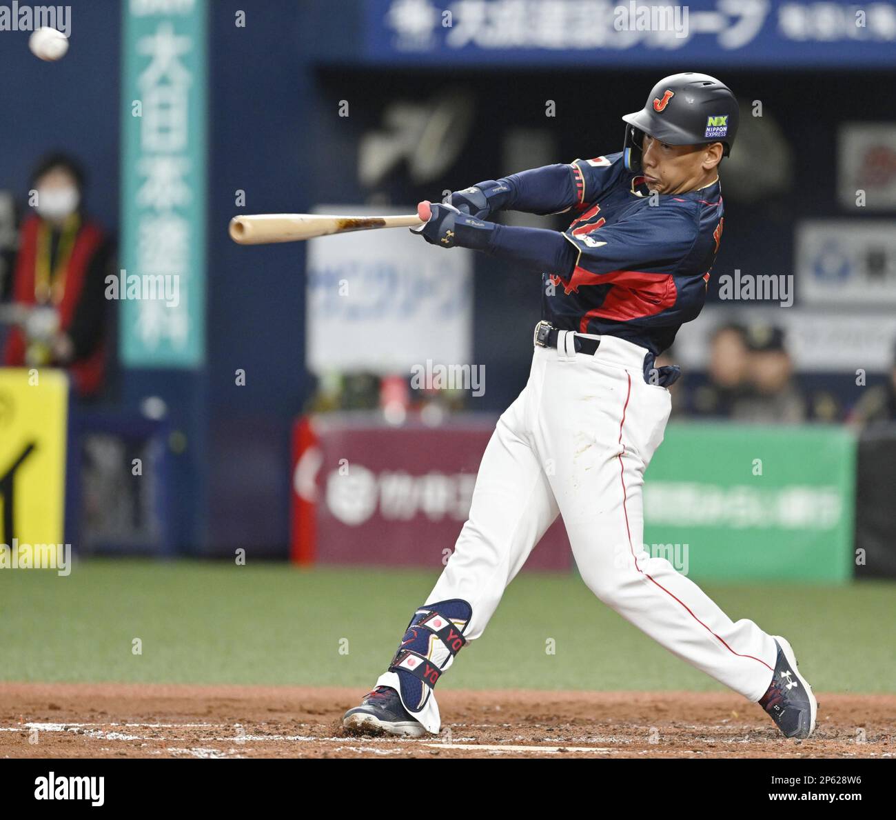 Masataka Yoshida of Japan's national baseball team gets a hit in the second inning of a World ...