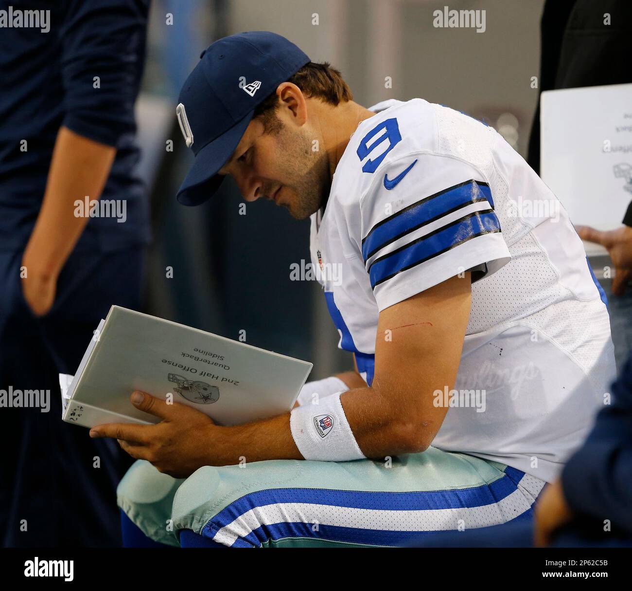 Dallas Cowboys quarterback Tony Romo (9) reviews preview plays during ...