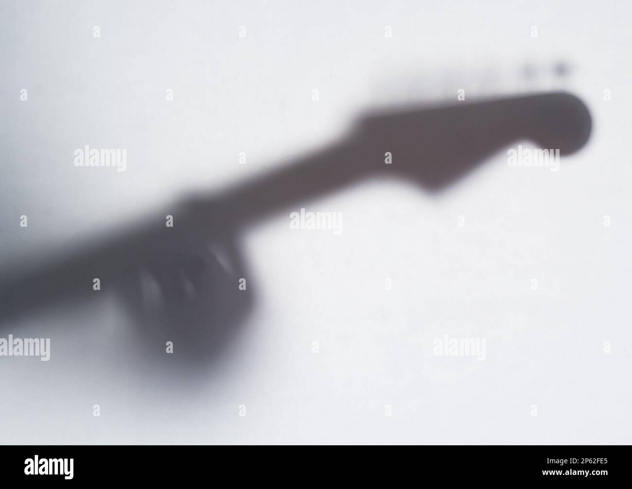 Silhouetted blur of musician playing electric guitar Stock Photo - Alamy