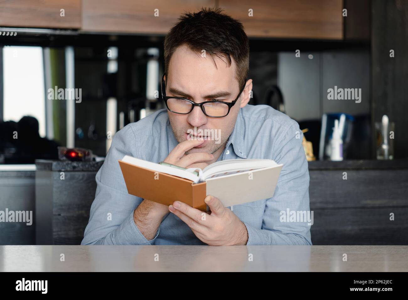 leisure, literature and people concept reading book at home. reader is ...