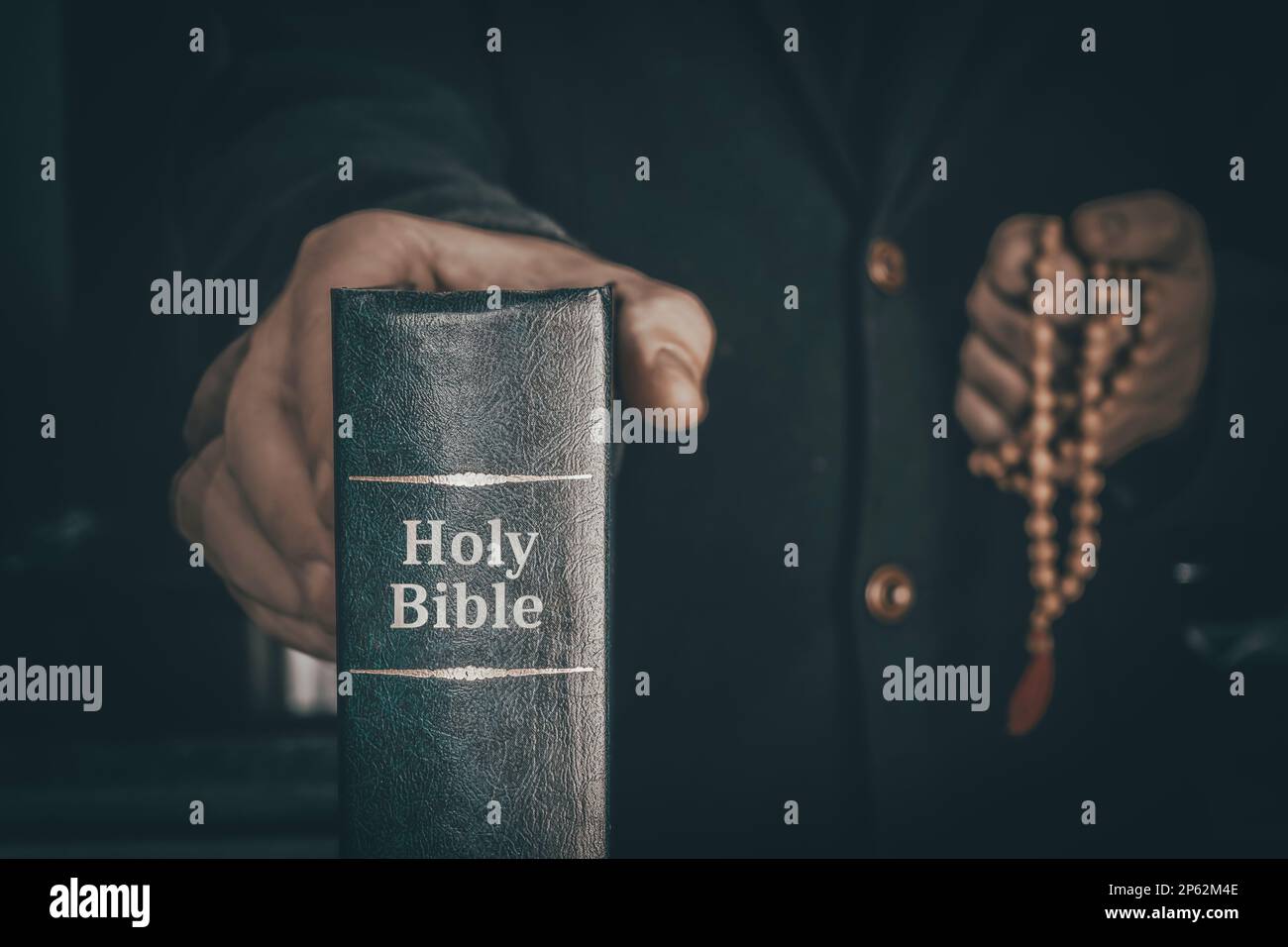 the Holy Bible in men's hands. The concept of faith and religion ...