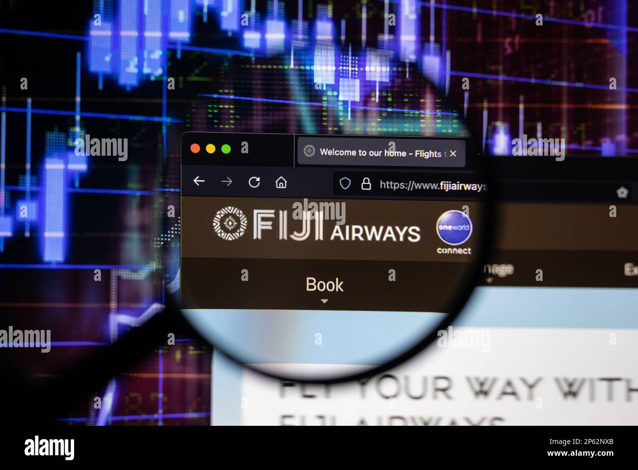 Fiji Airways company logo on a website with blurry stock market developments in the background ...
