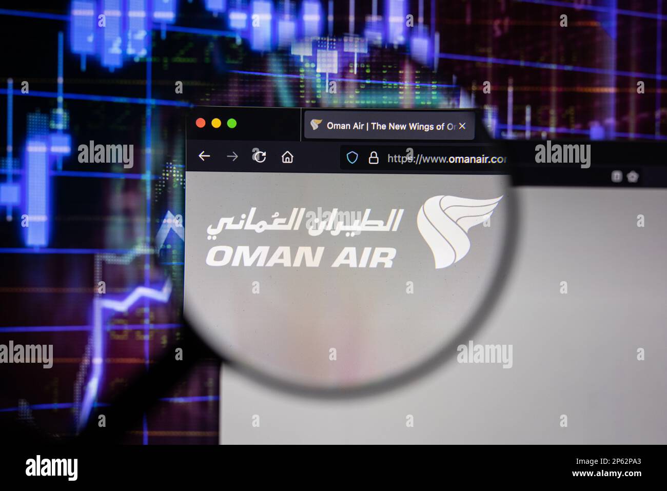 Oman Air airline company logo on a website with blurry stock market ...