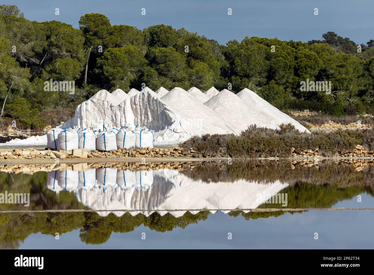 salt evaporation pond of Salinas de s'Avall with piles of salt in ...