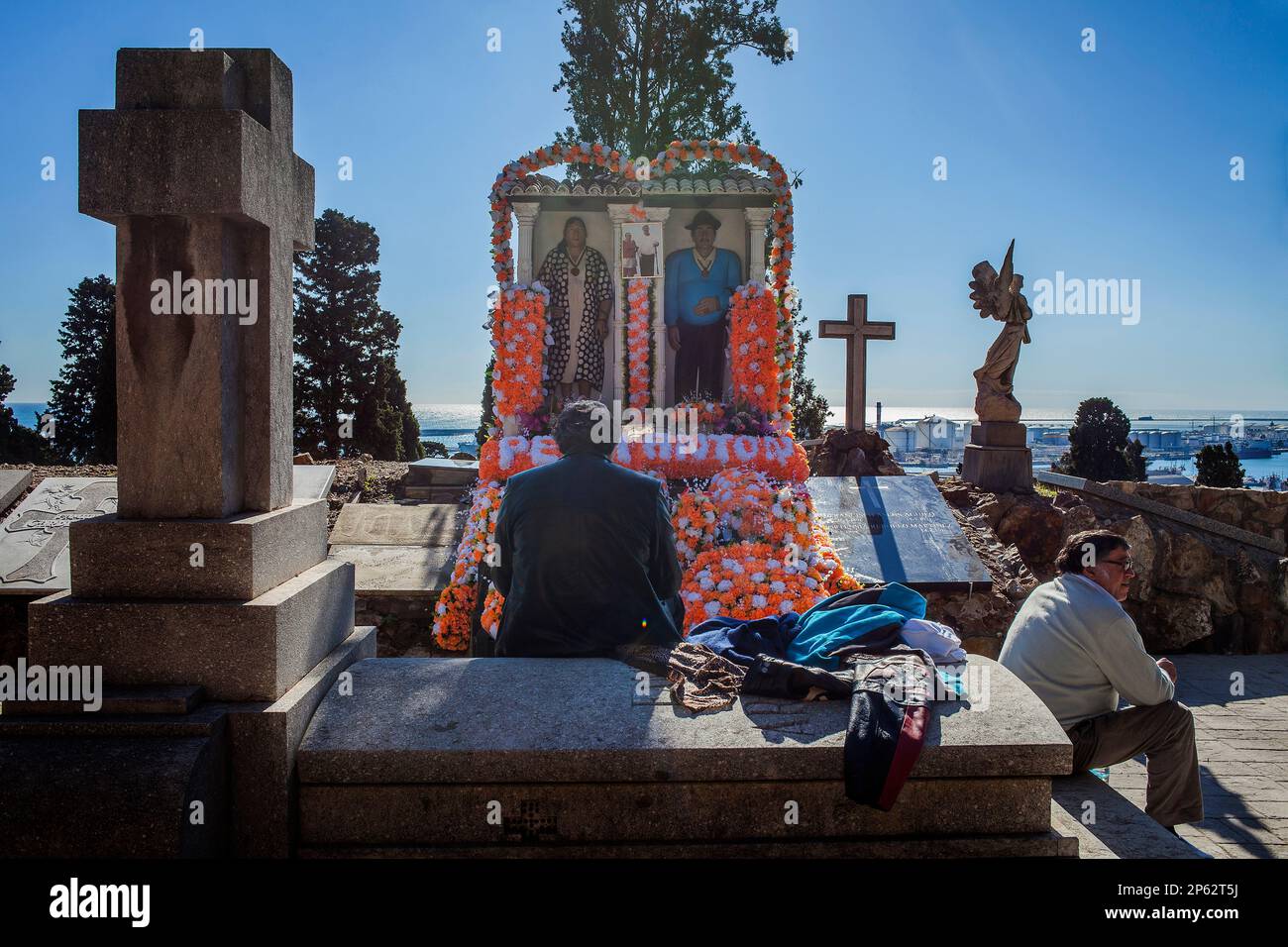 A gypsy family tomb. People visiting their dead. All Saints' Day in ...