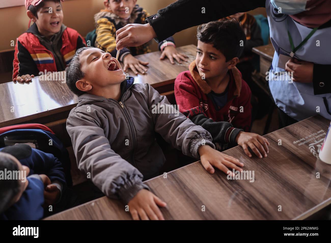 Sarmada, Syria. 07th Mar, 2023. A child receives a cholera vaccine at a ...