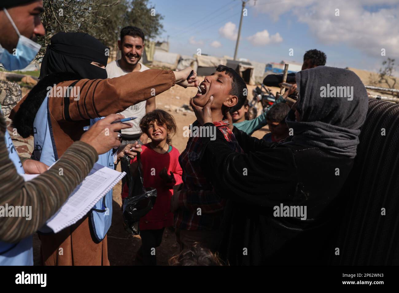 Sarmada, Syria. 07th Mar, 2023. A child receives a cholera vaccine at a ...