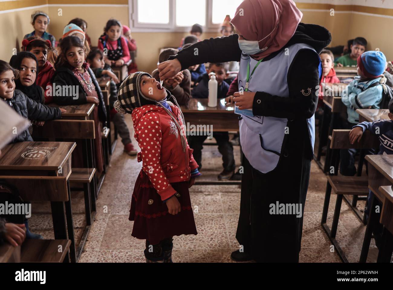 Sarmada, Syria. 07th Mar, 2023. A child receives a cholera vaccine at a ...