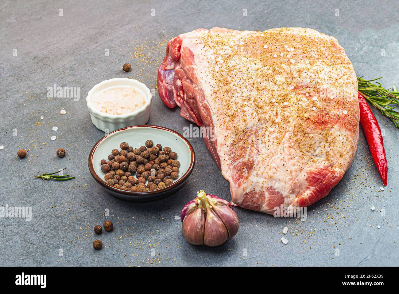 Raw pork shoulder with spices and herbs. Fresh meat cut, ingredient for ...
