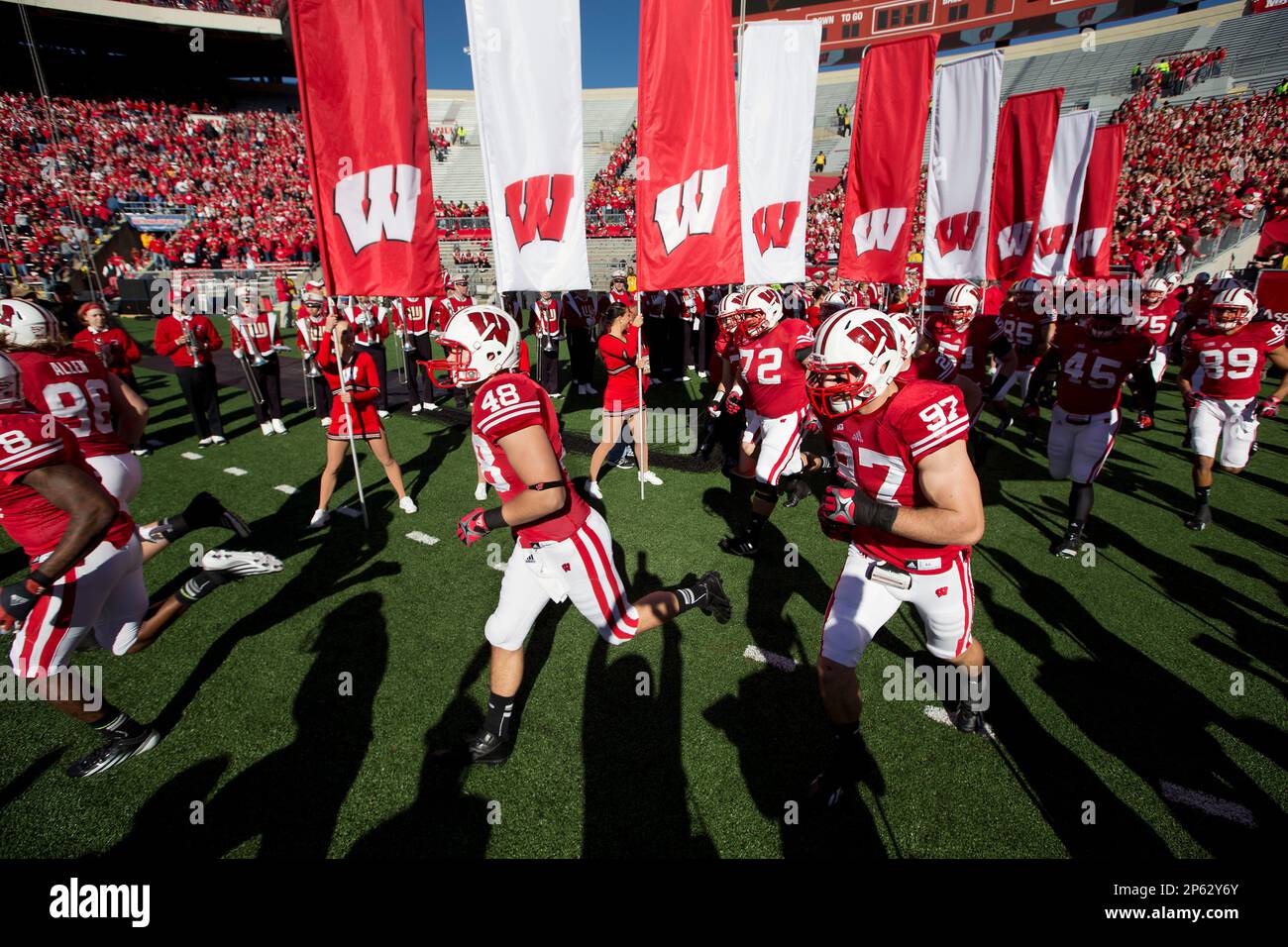 Wisconsin Badgers football team runs onto the field prior to an NCAA ...