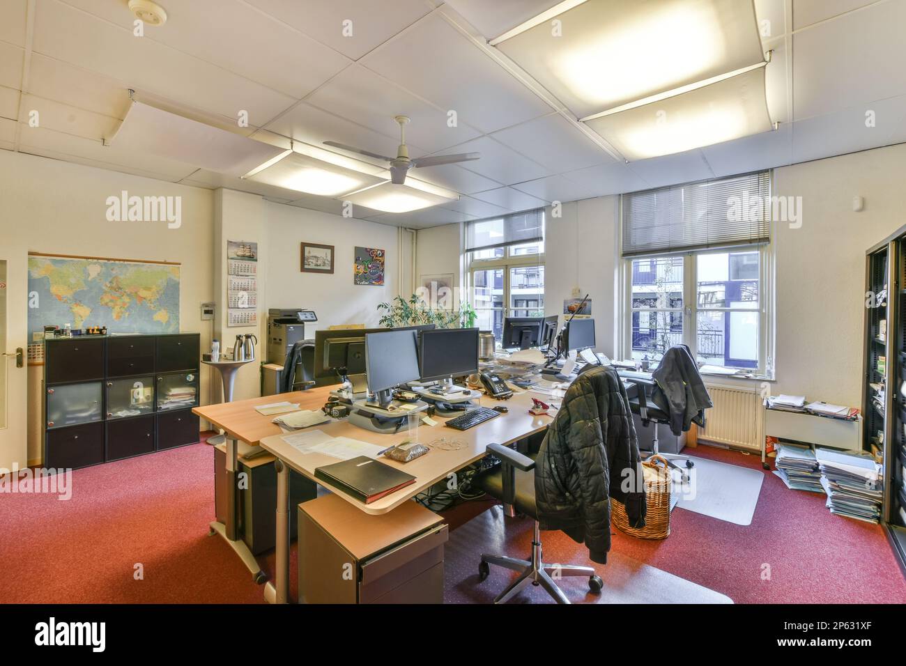 an office space with desks, computers and other items on the floor in ...