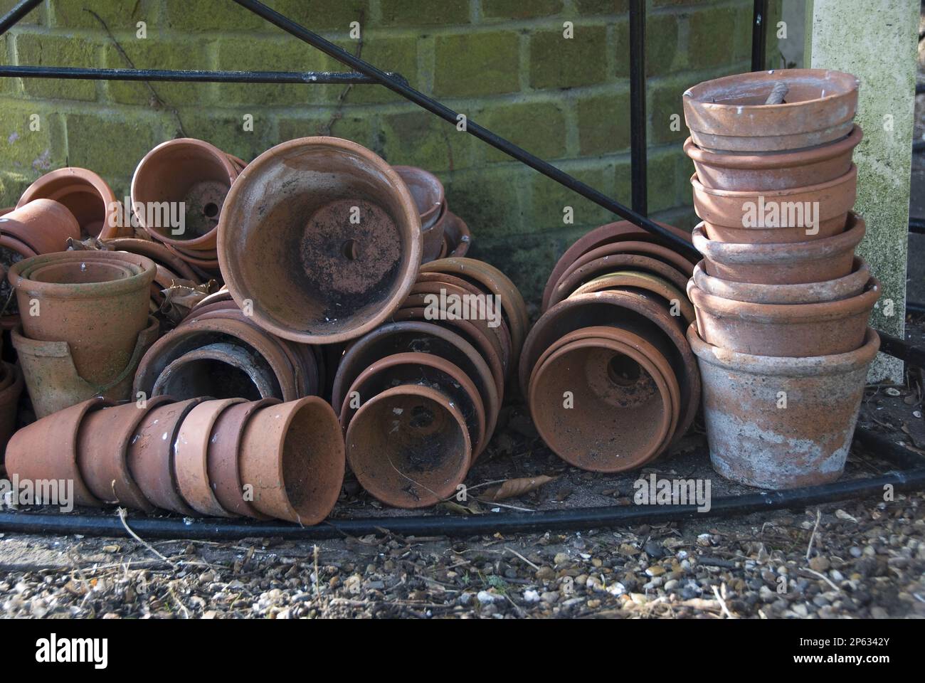 empty dirty terracotta garden pots in stacks Stock Photo - Alamy