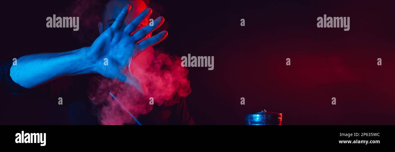 Man smokes in neon red hi-res stock photography and images - Alamy
