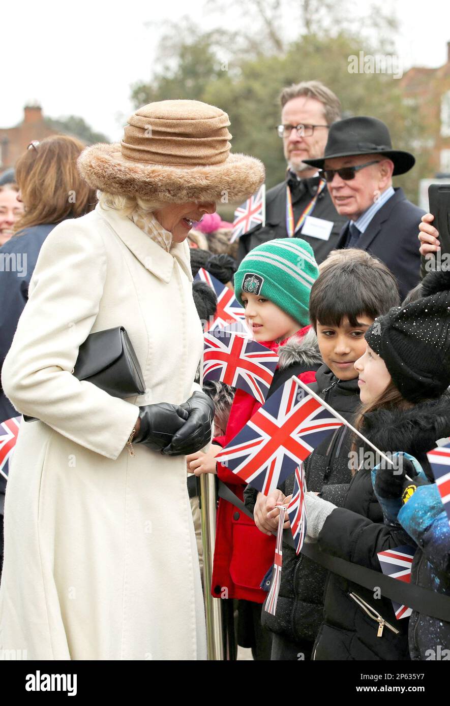 The Queen Consort speaks to a group of young children as she arrives ...