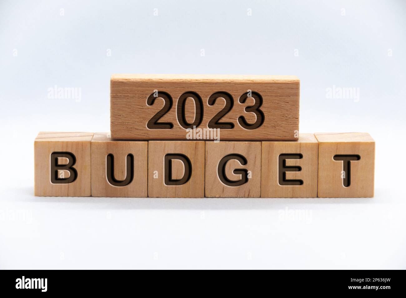 Budget 2023 text engraved on wooden blocks with white cover background ...