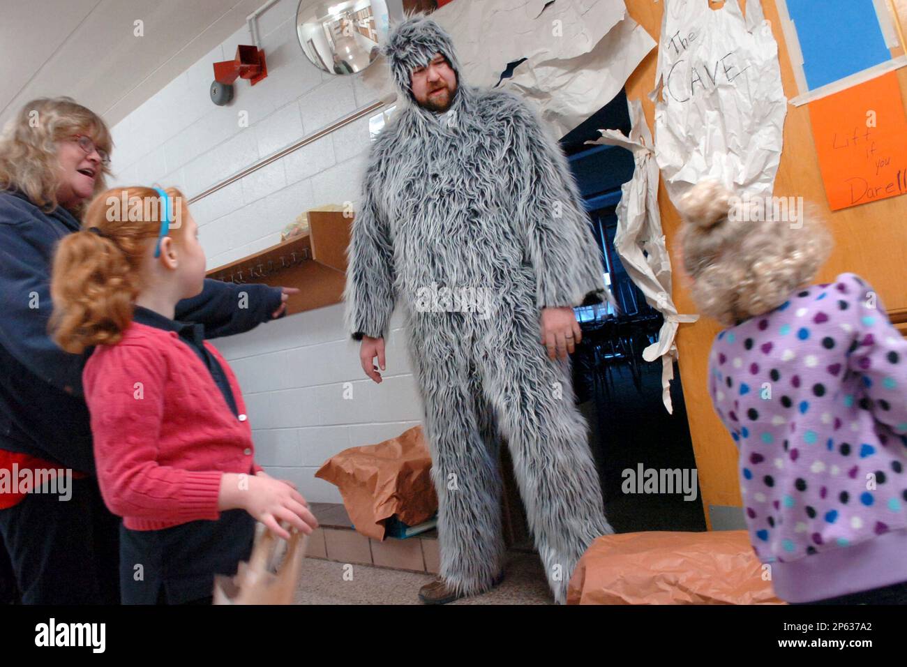 Dressed as sasquatch, fourth-grade teacher Ryan Parrott talks with ...