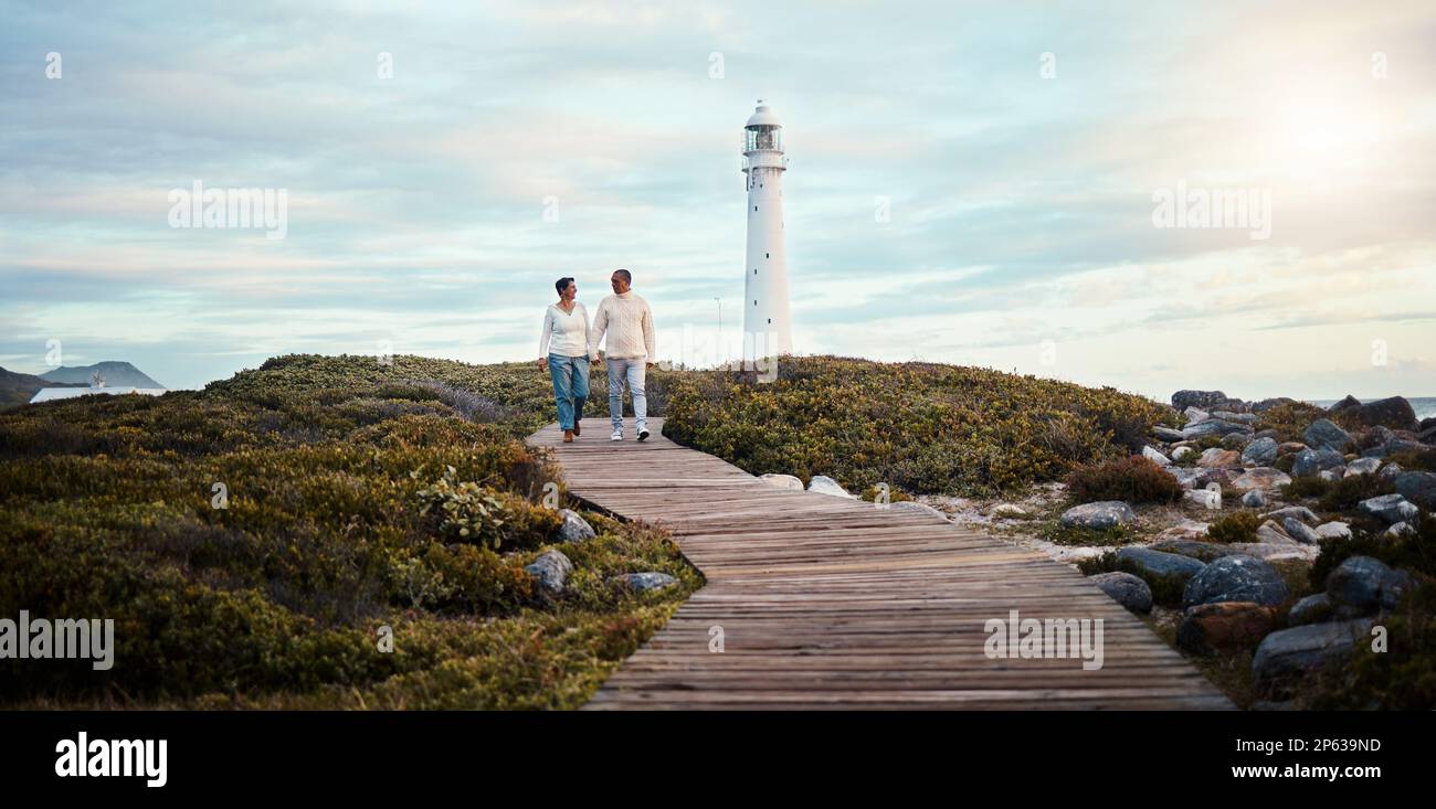 Romance, love and a couple holding hands while walking on the beach ...