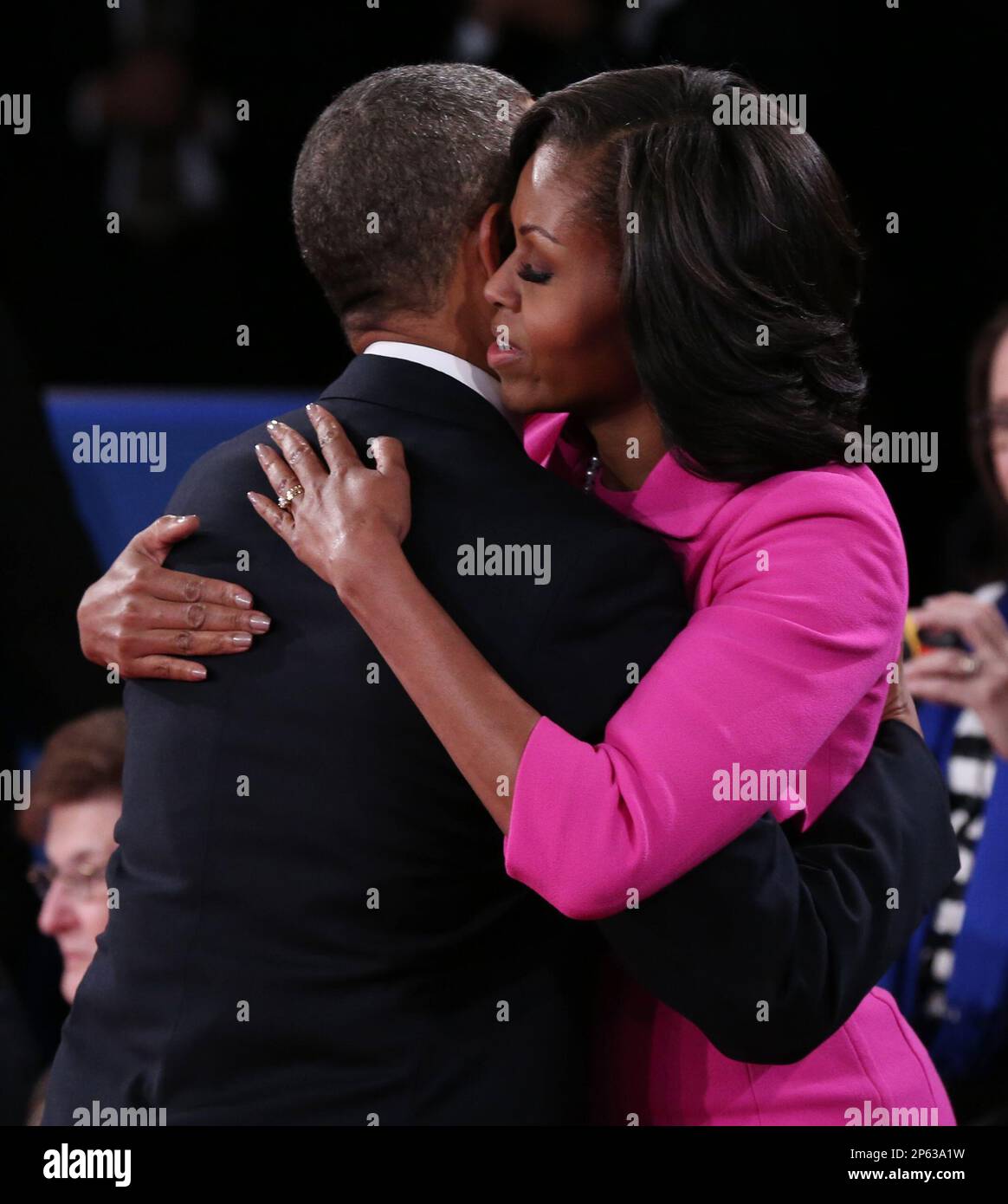 President Barack Obama hugs his wife Michelle following the second ...