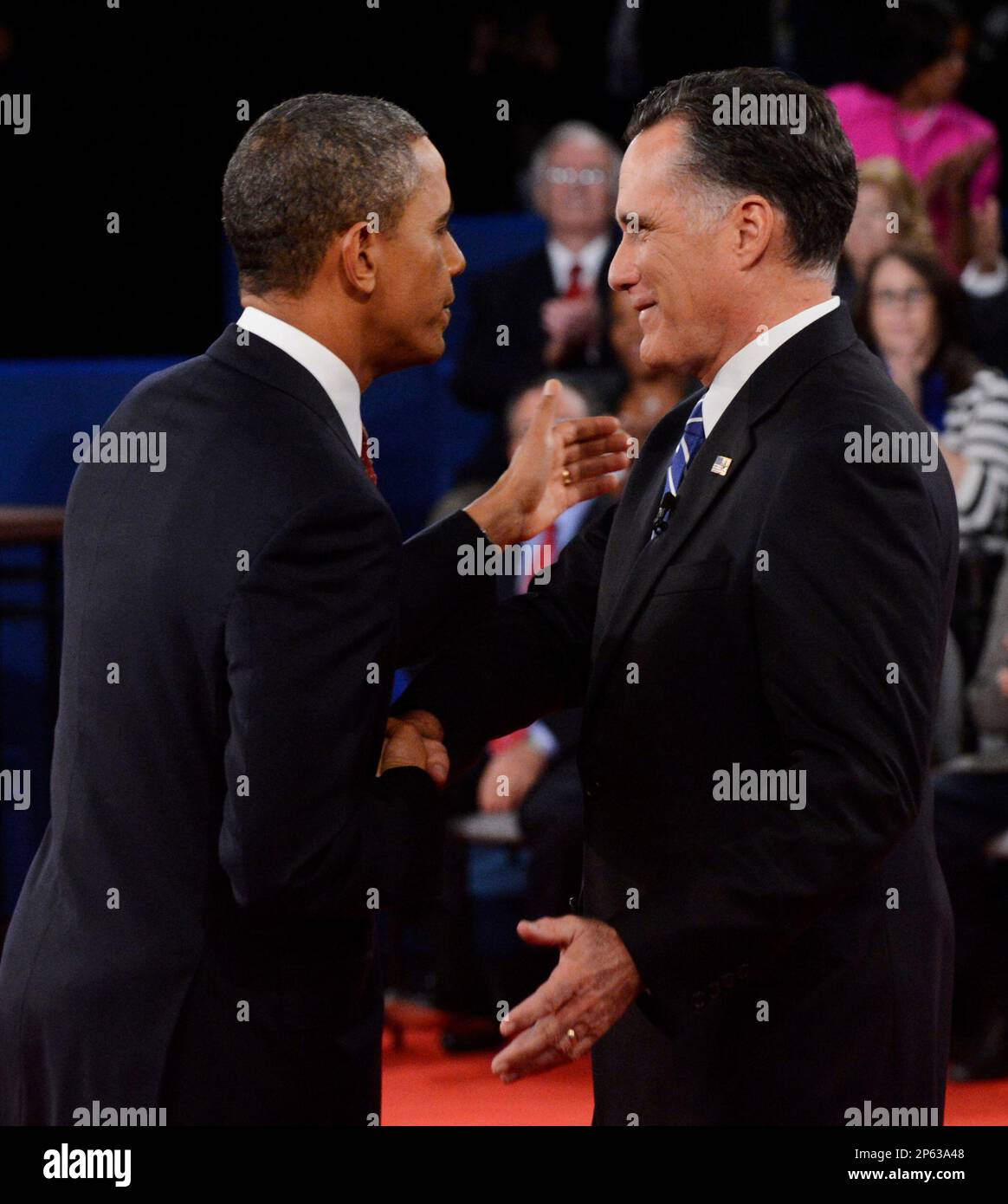 President Barack Obama, left, shakes hands with Republican presidential ...