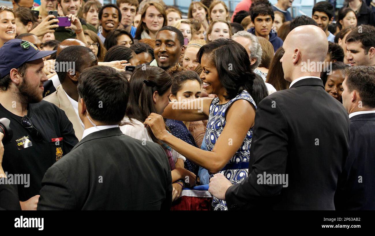 First lady Michelle Obama works the rope line after her speech at ...