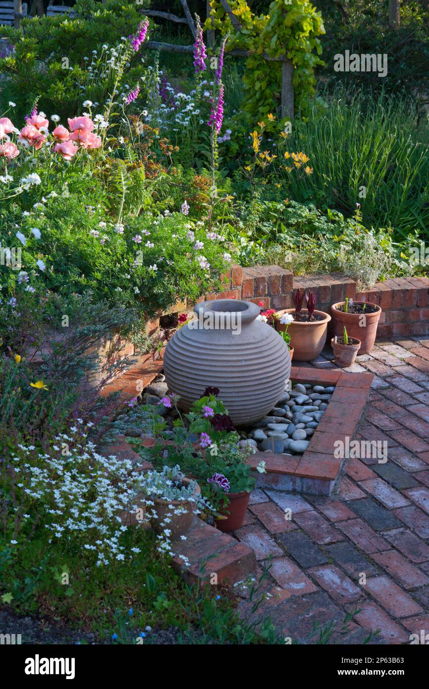 An ornamental pot makes a perfect focal point in this quiet corner of ...