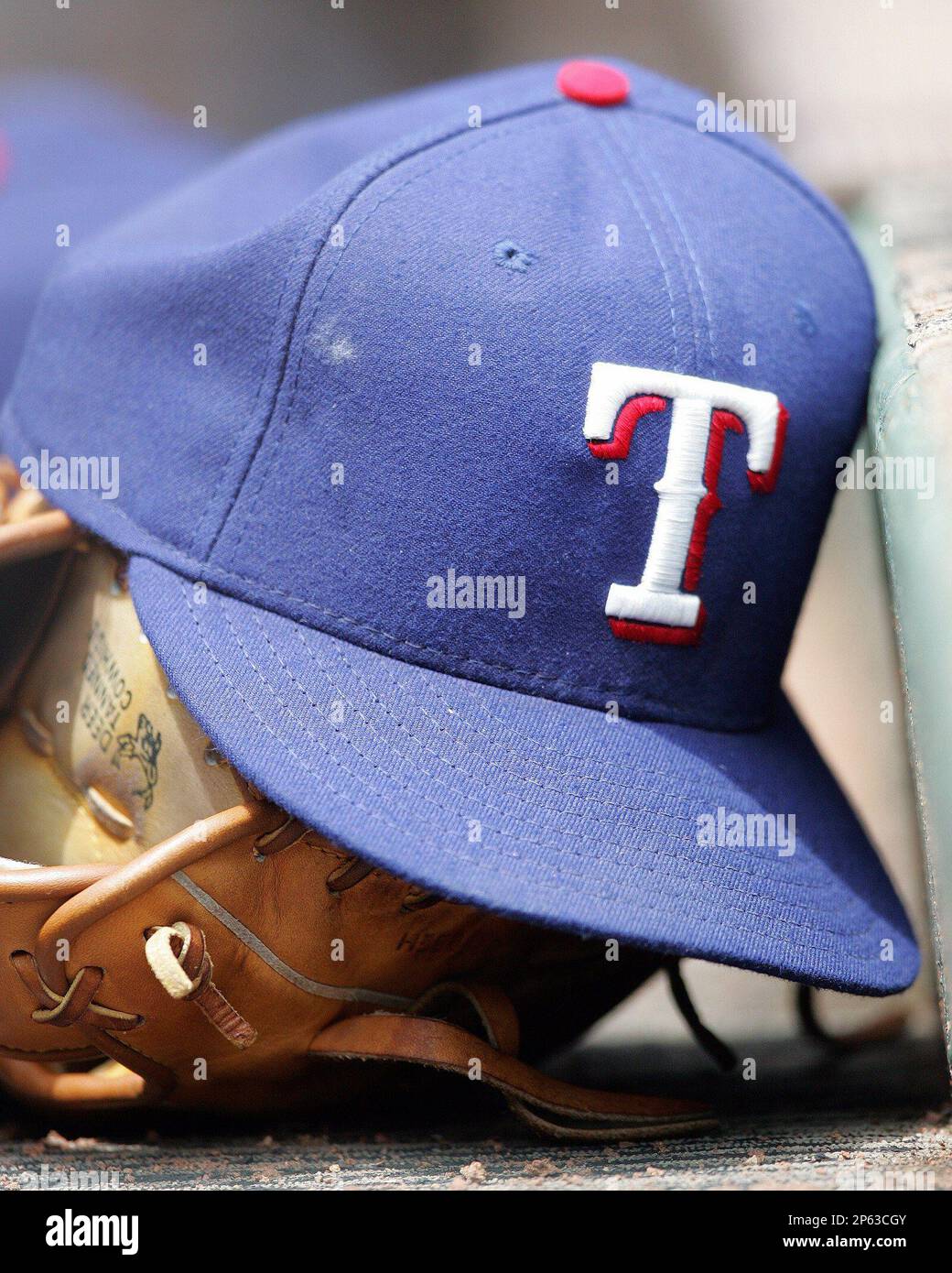 Texas Rangers baseball cap and glove. (Andrew Woolley/Four Seam Images ...