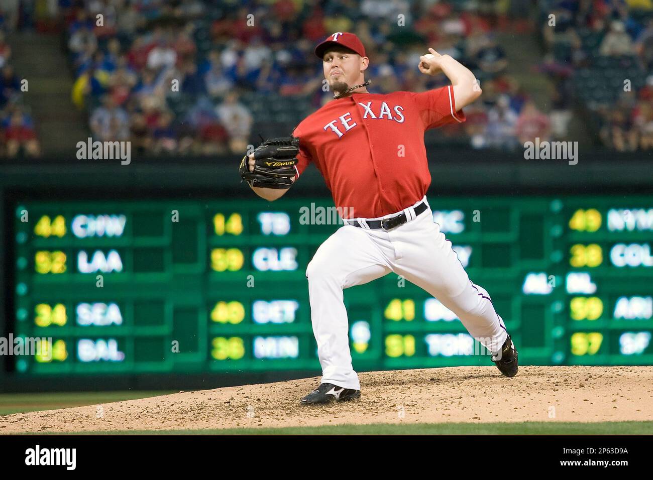 Texas Rangers starting pitcher Matt Harrison (54) delivers against the ...