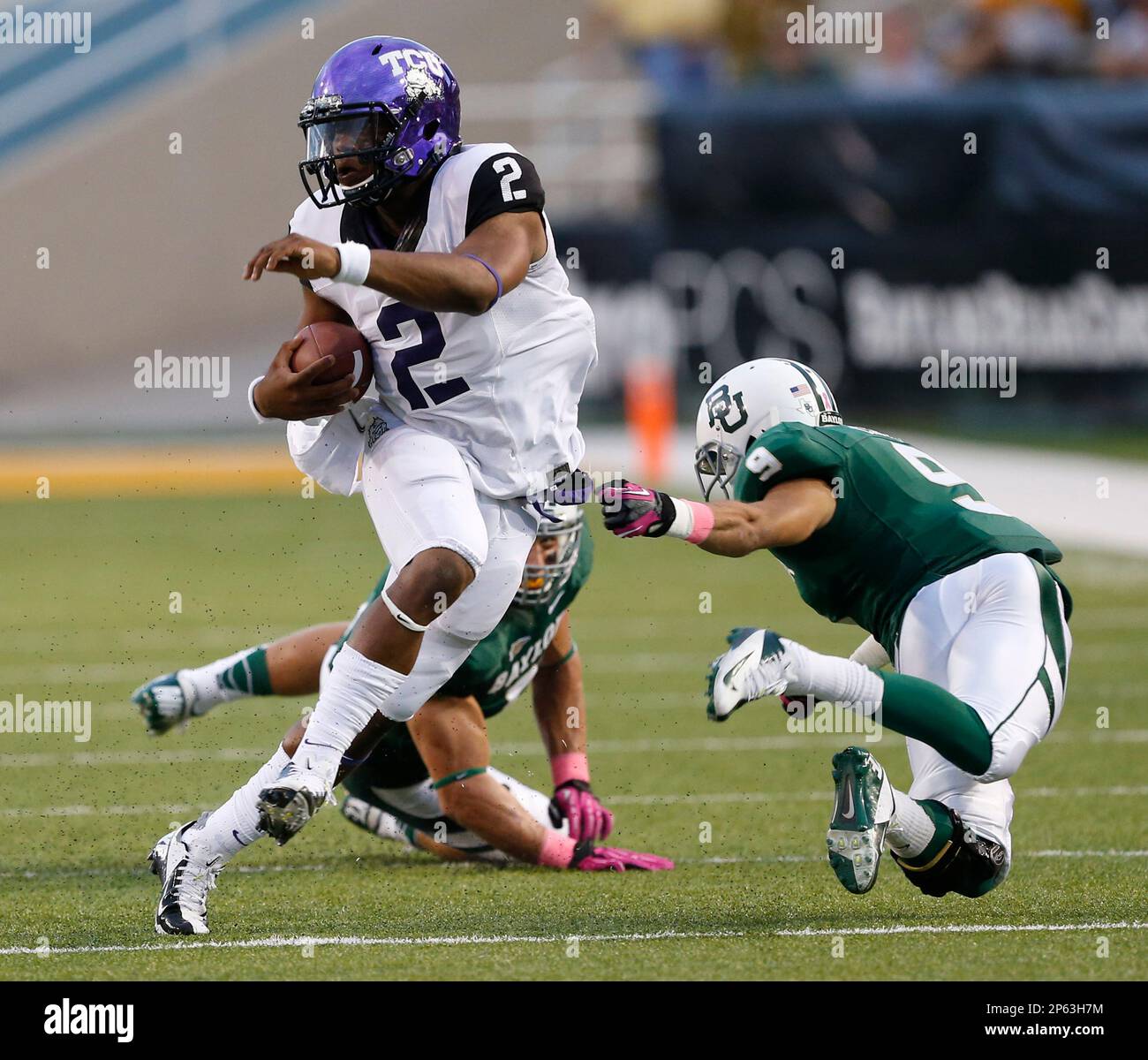 TCU quarterback Trevone Boykin (2) runs past Baylor cornerback Chance ...