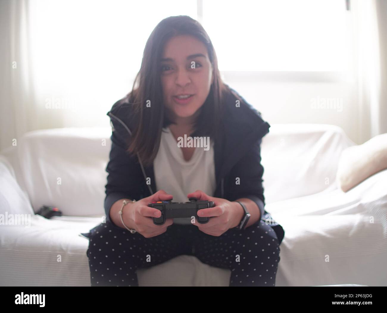 Woman's hands using gamepad close-up view playing video console game at ...