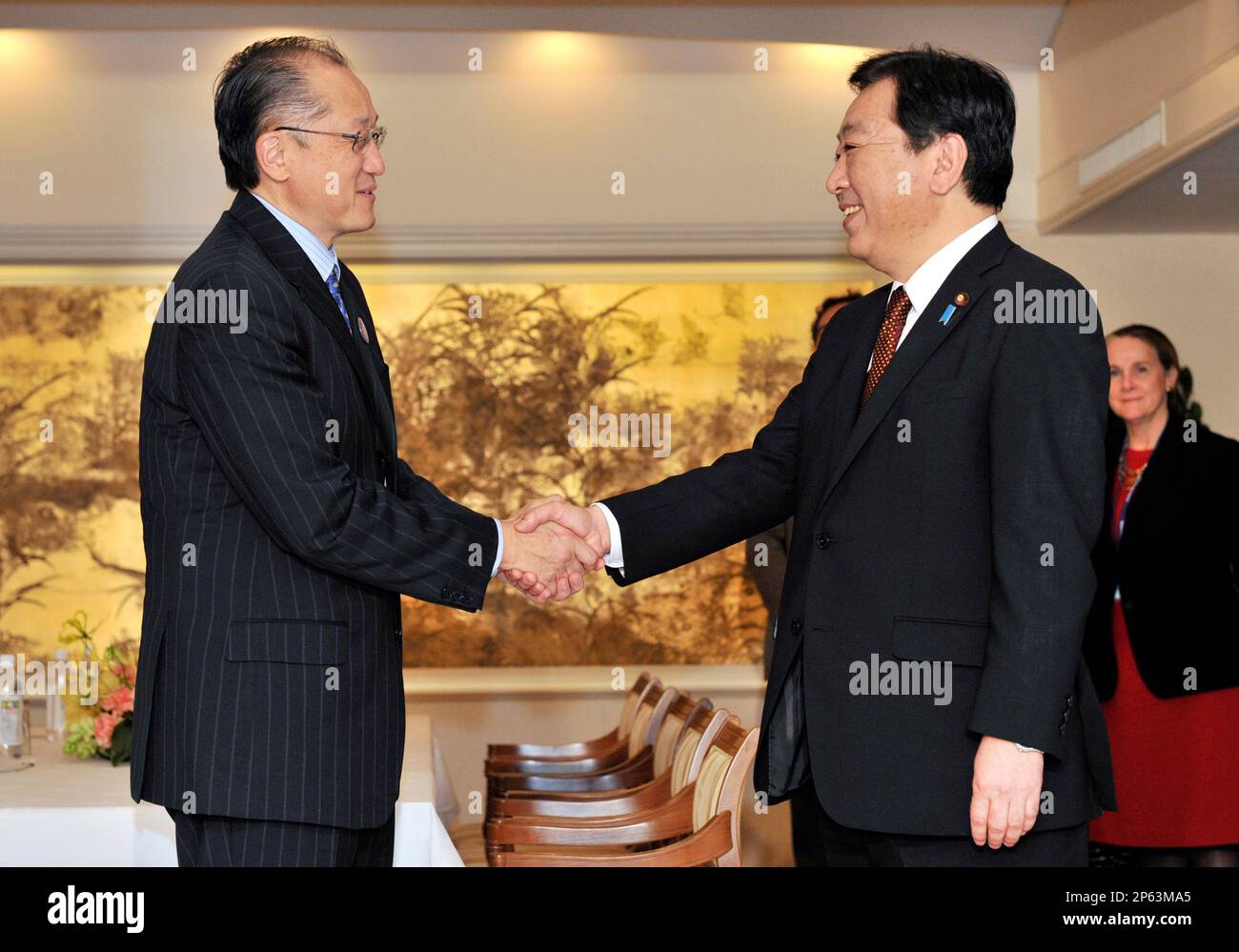 World Bank Group President Jim Yong Kim, left, shakes hands with ...