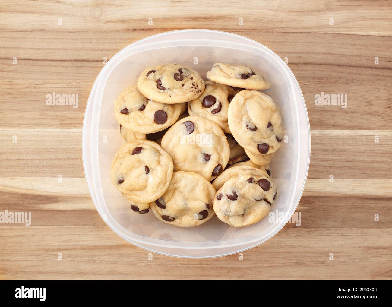 Homemade chocolate chip cookies in plastic food container Stock Photo ...