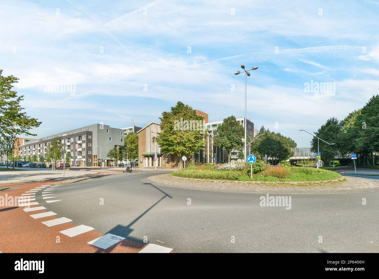an intersection in the middle of a street with buildings and trees on ...