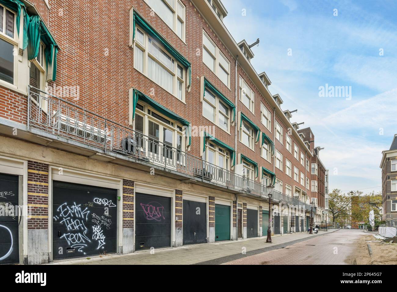 Amsterdam, Netherlands - 10 April, 2021: a brick building with graffiti ...
