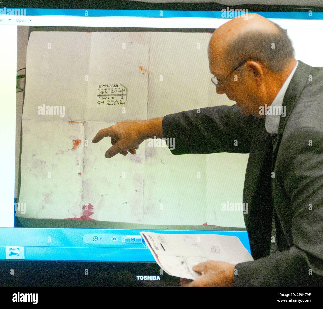 Forensic scientist Gary M. Ginther, a latent fingerprint examiner from ...