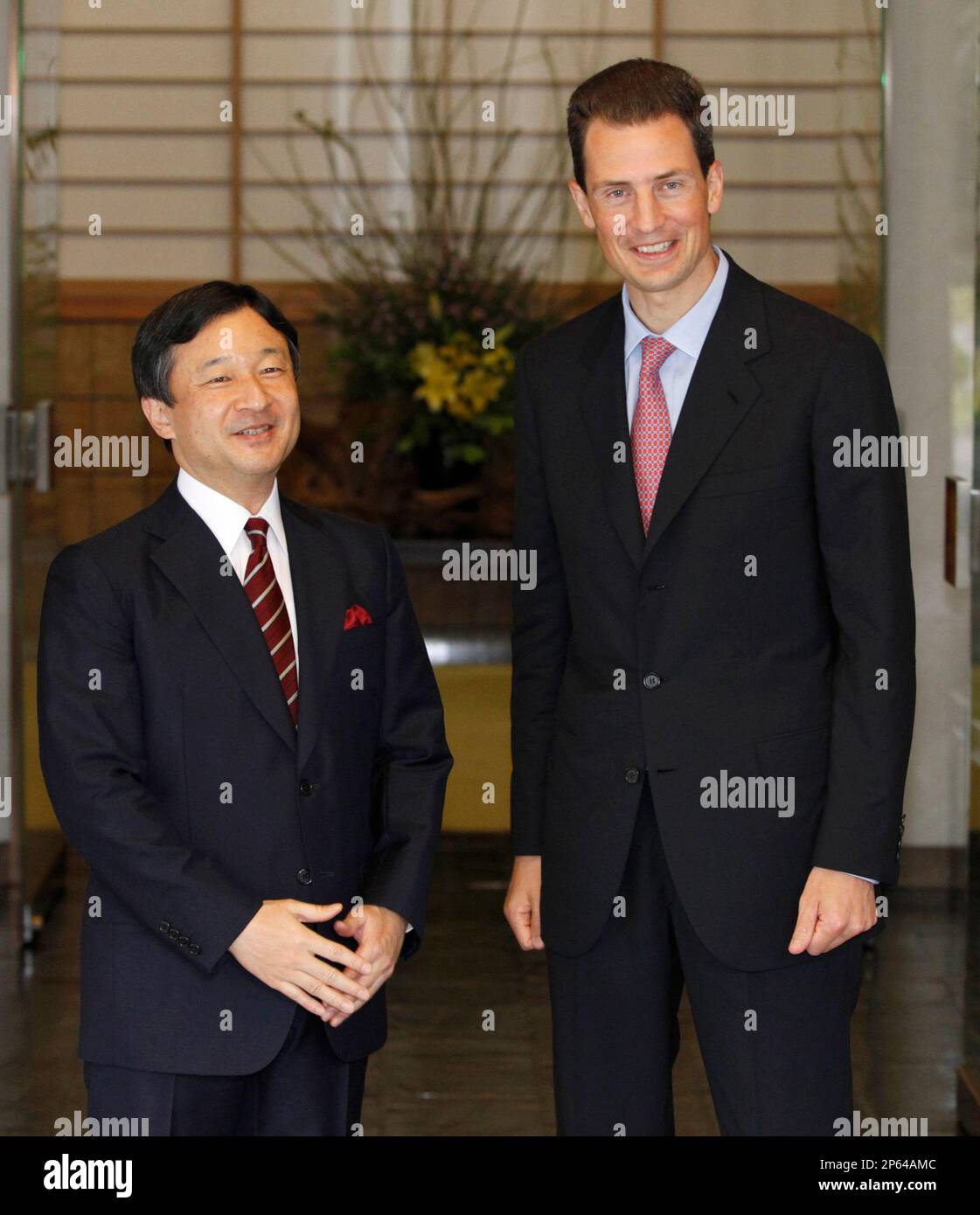 Hereditary Prince Alois of Liechtenstein, right, is greeted by Japanese ...